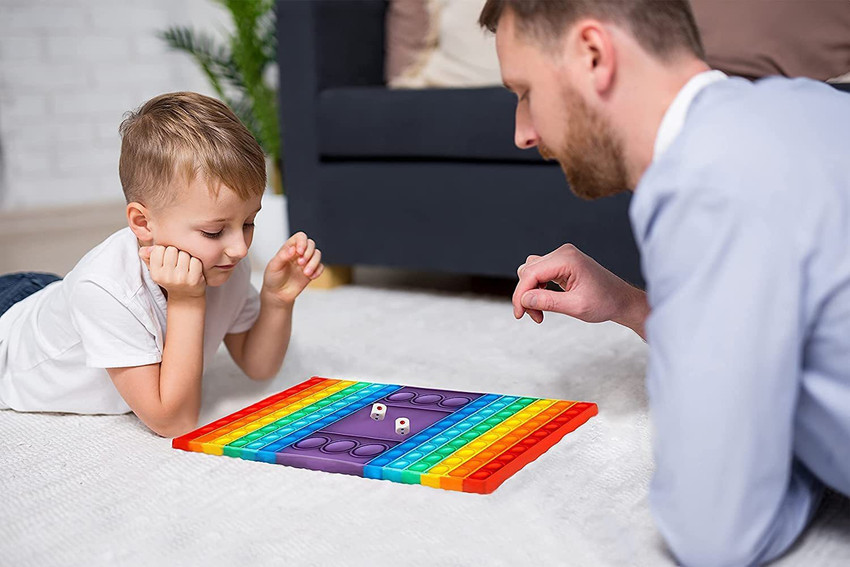 Boy Pushing Toy Popper